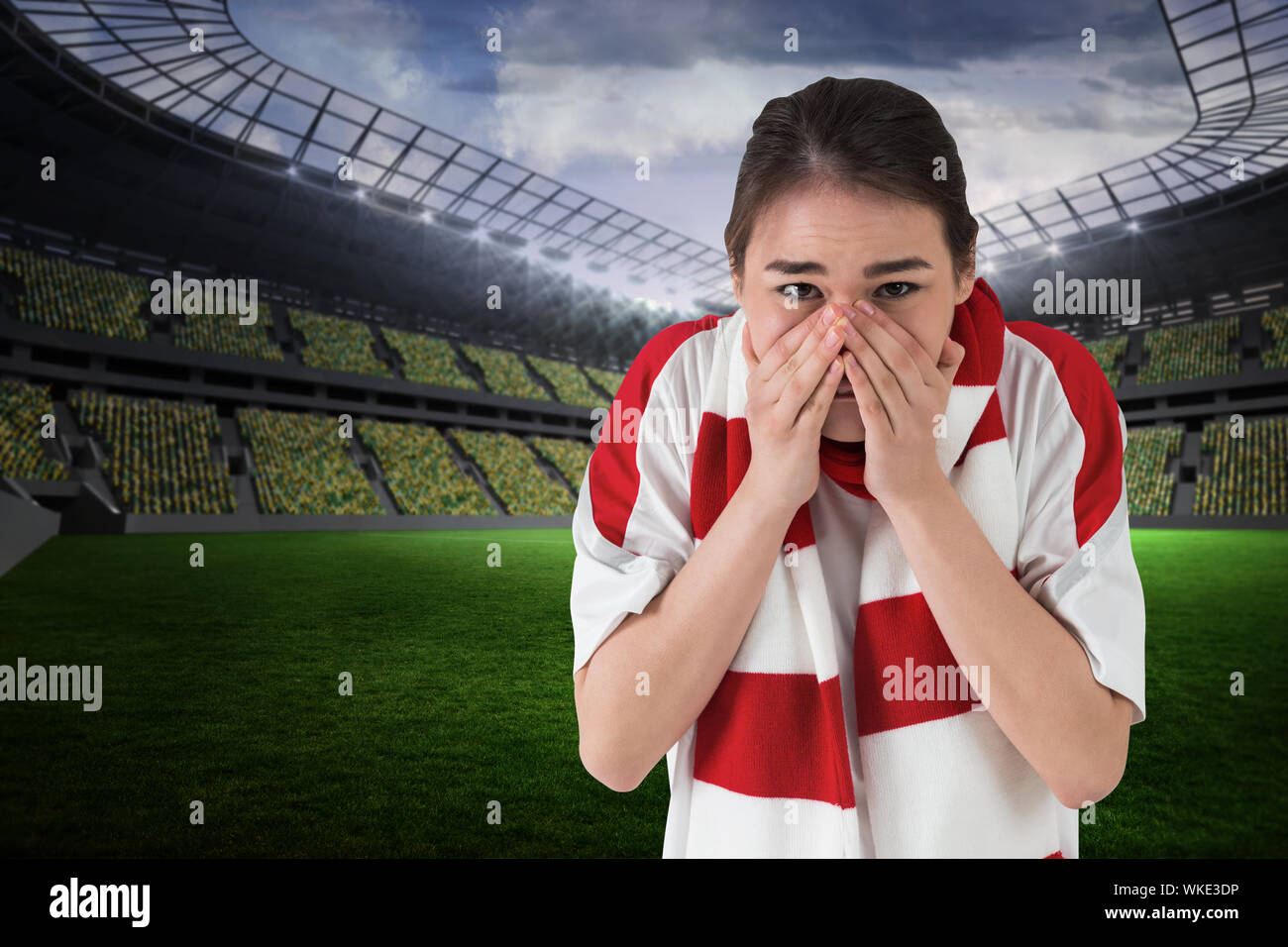Nervous football fan looking ahead in a large football stadium with ...