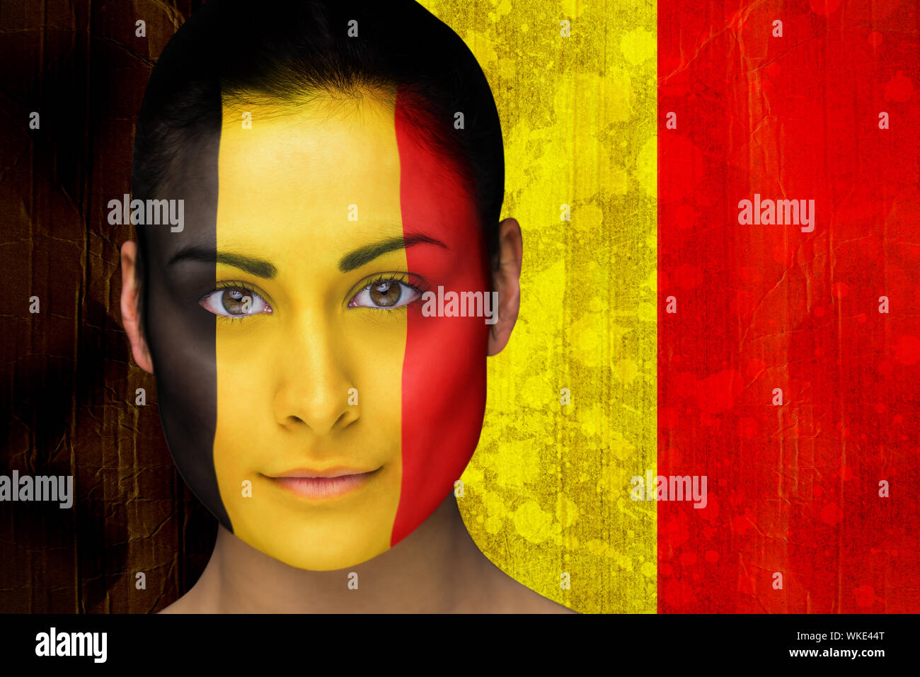 Composite image of beautiful football fan in face paint against belgium ...
