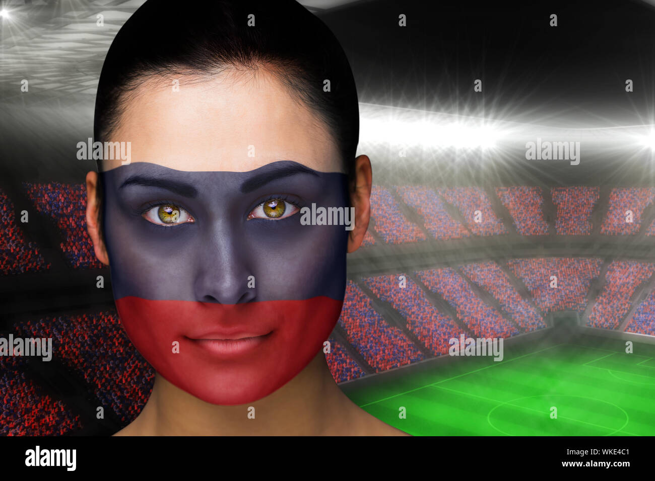 Composite image of beautiful russia fan in face paint against large ...