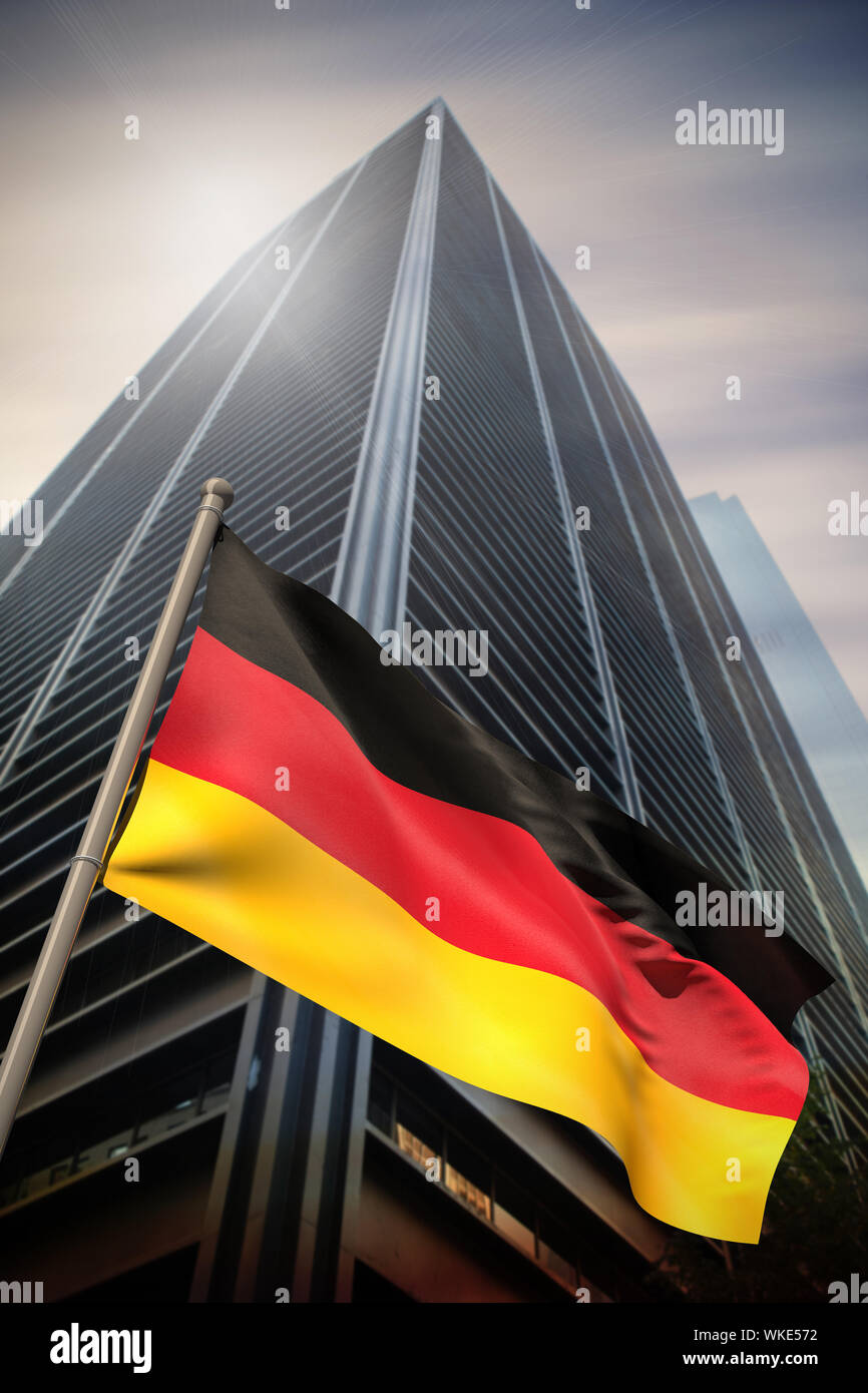 Germany national flag against low angle view of skyscraper Stock Photo ...