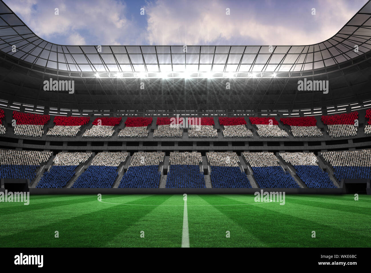 Digitally generated netherlands national flag against large football ...