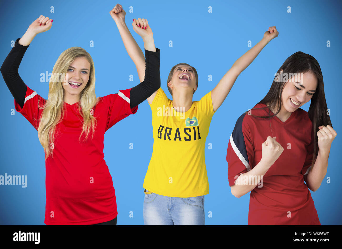Composite image of football fans against blue background with vignette ...