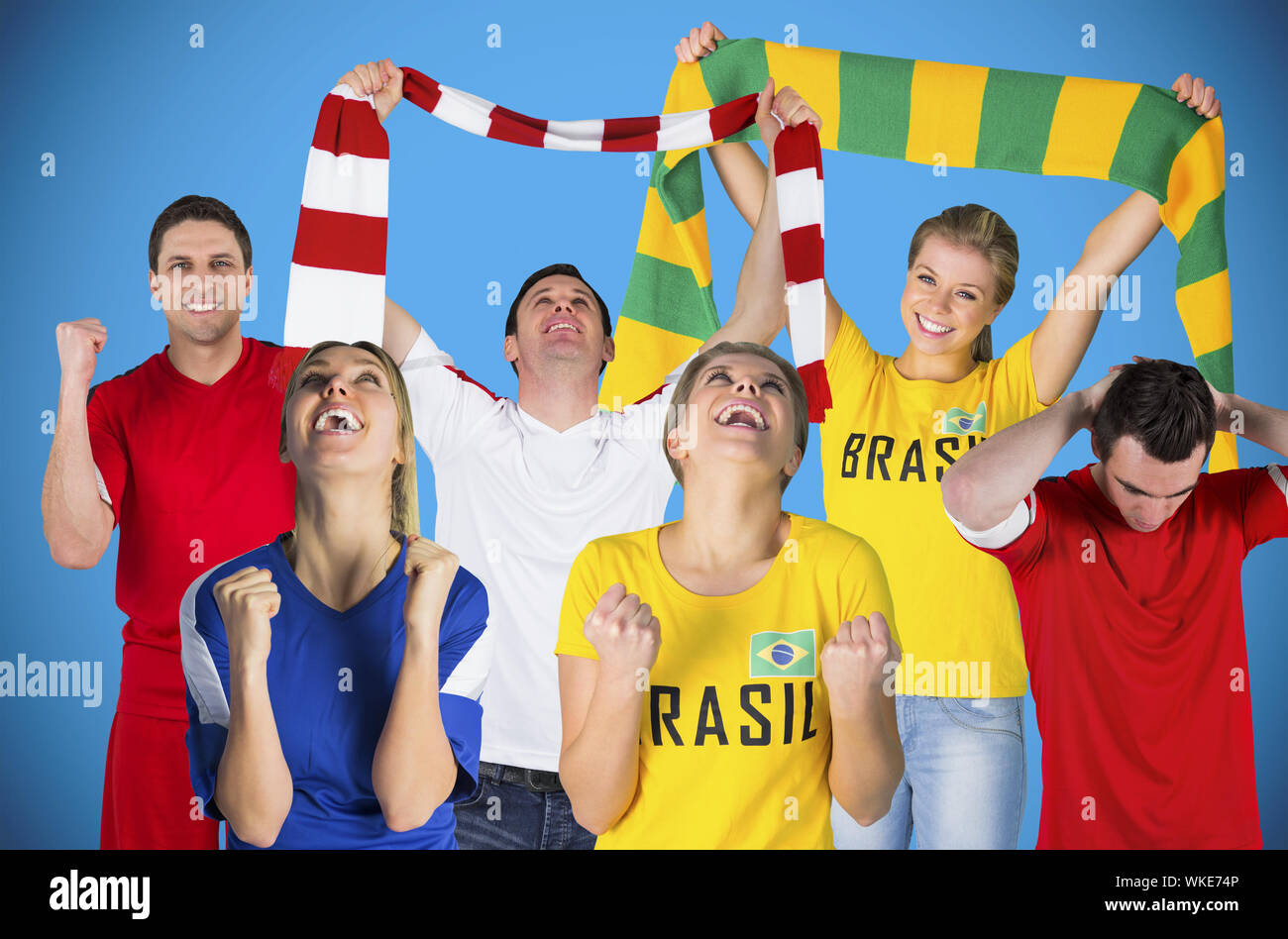 Composite image of football fans against blue background with vignette ...