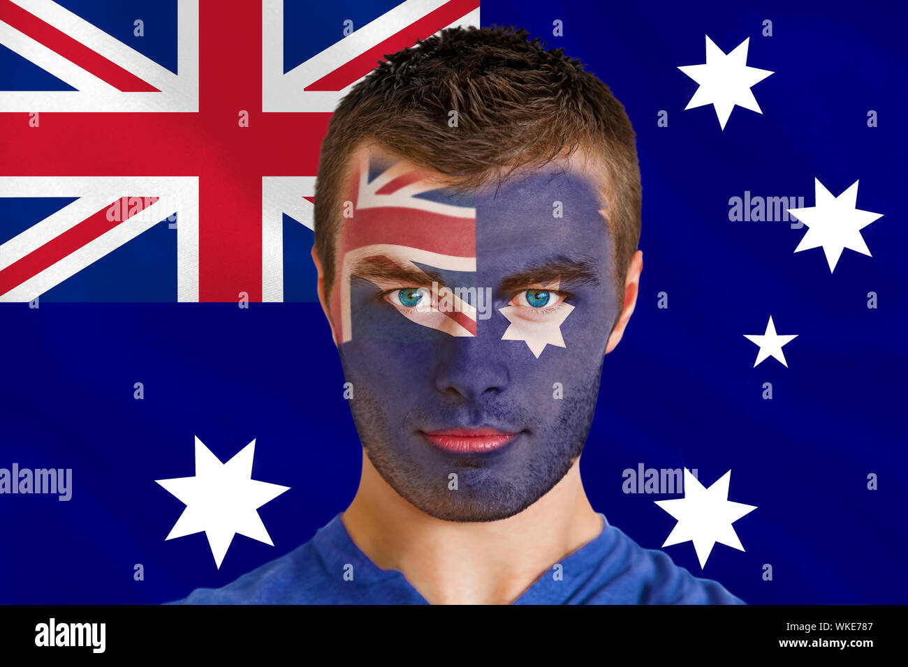 Composite image of serious young australia fan with facepaint against ...