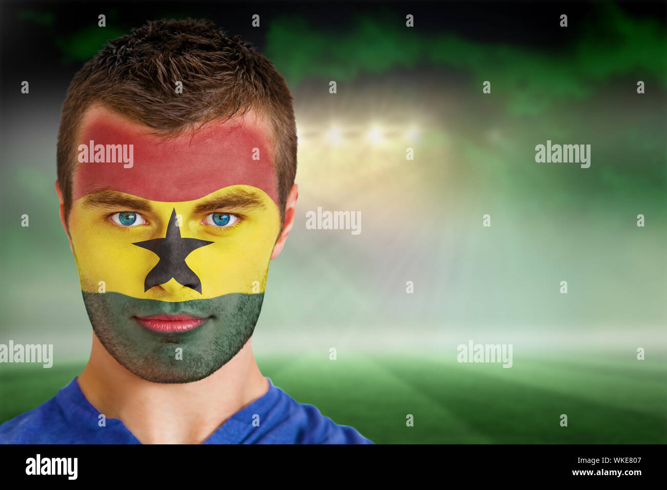 Composite image of serious young ghana fan with face paint against ...