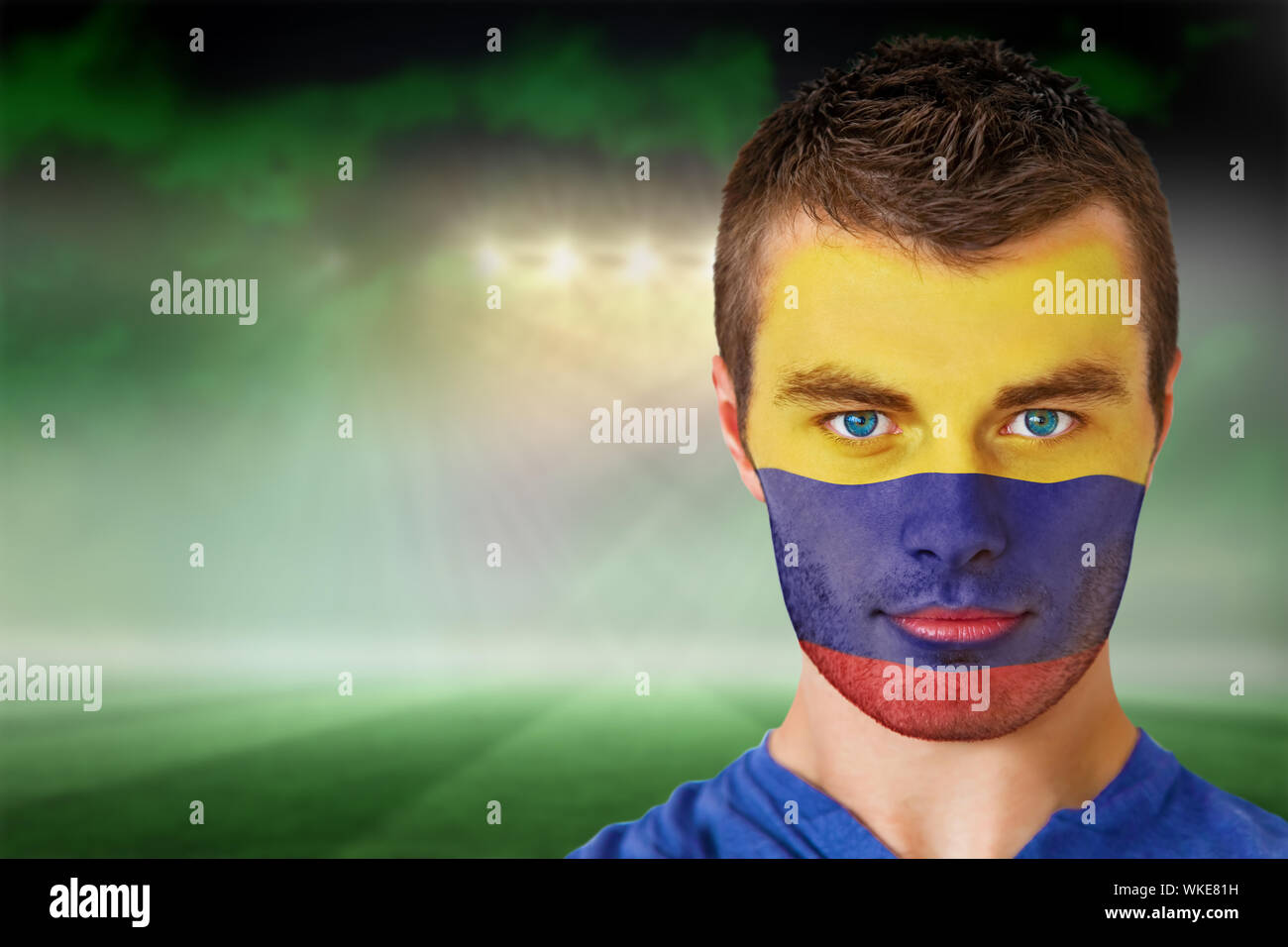 Composite image of colombia football fan in face paint against football ...