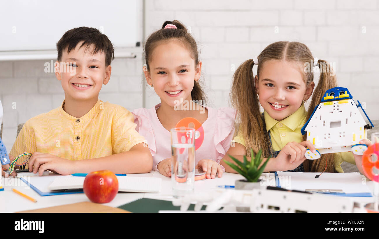 Stem education. Children building robots in classroom Stock Photo - Alamy
