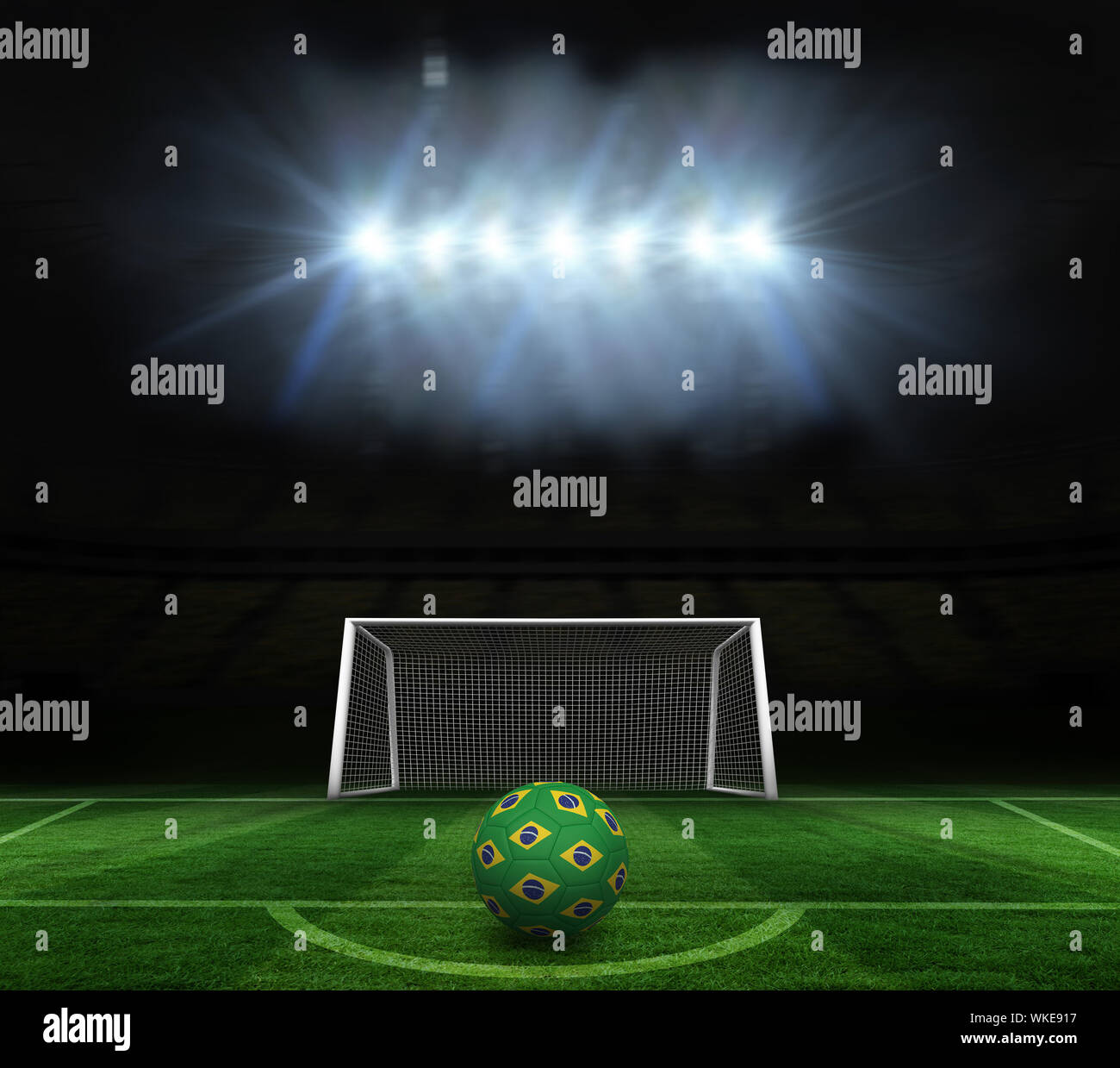 Football in brazilian colours against football pitch and goal under ...