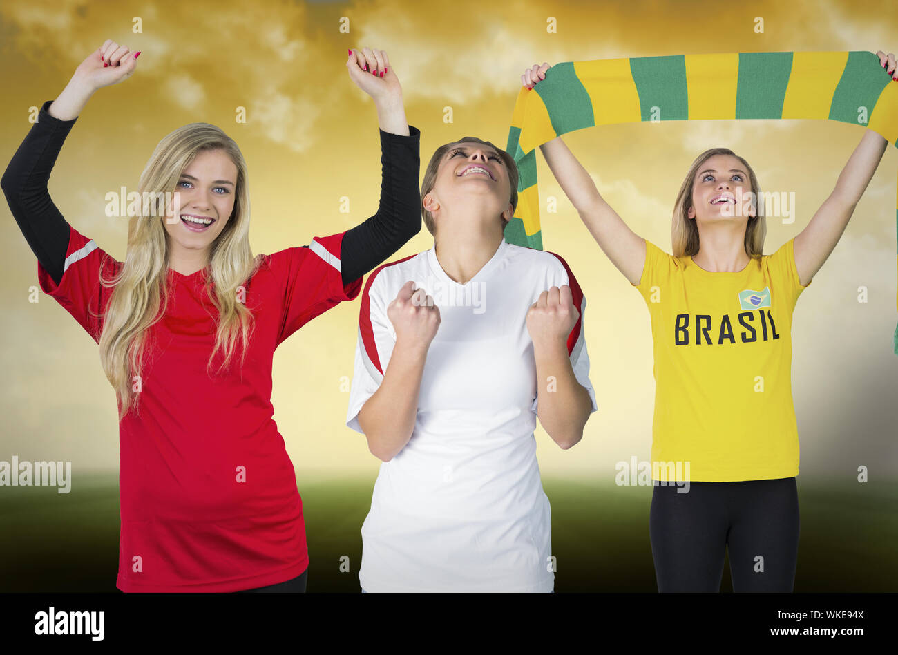 Composite image of various football fans against football pitch under ...