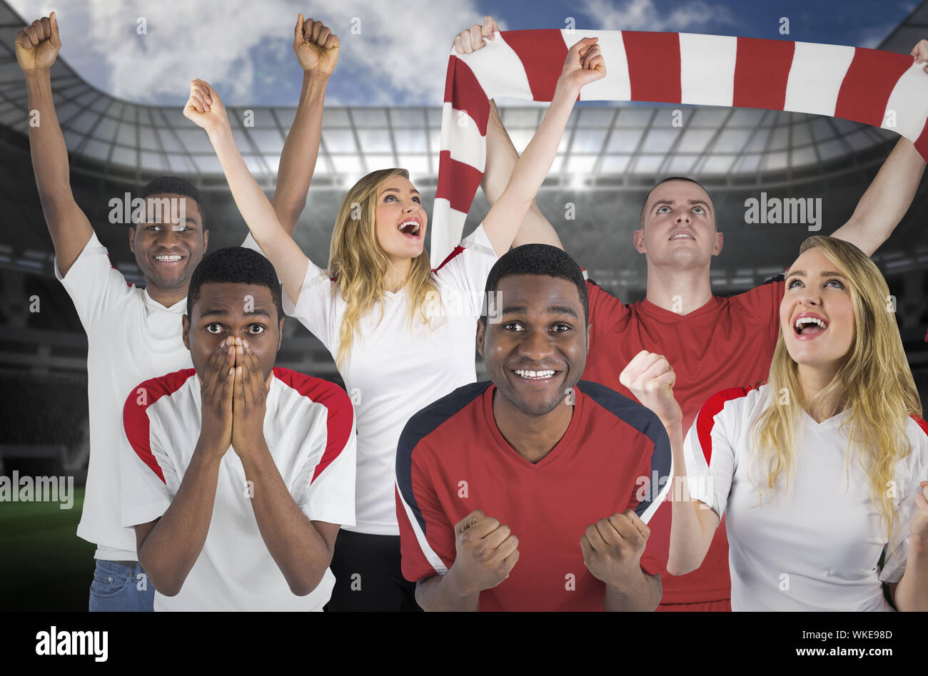 Composite image of various football fans against large football stadium ...