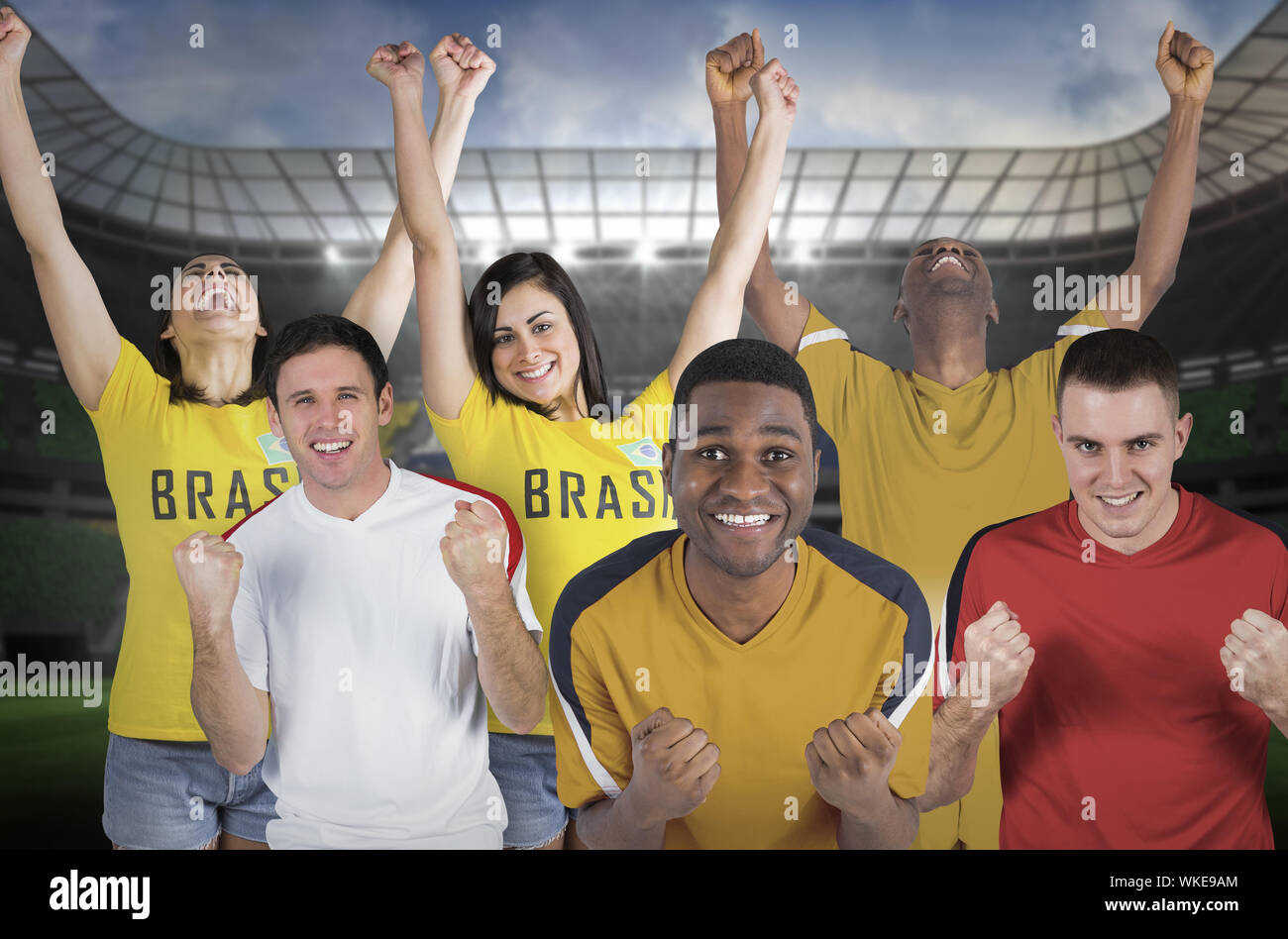 Composite image of various football fans against large football stadium ...