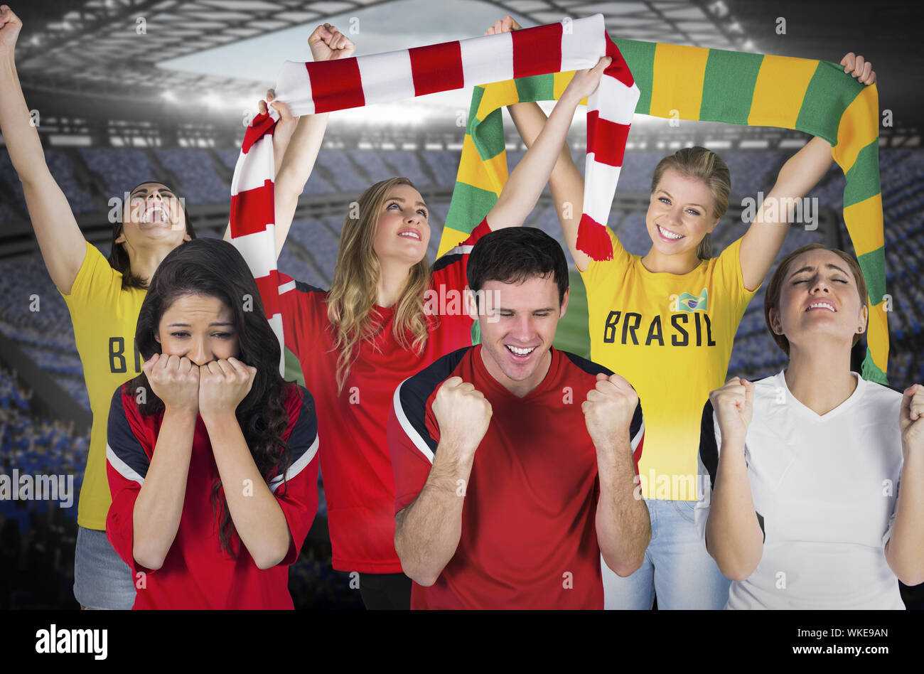 Composite image of various football fans against large football stadium ...