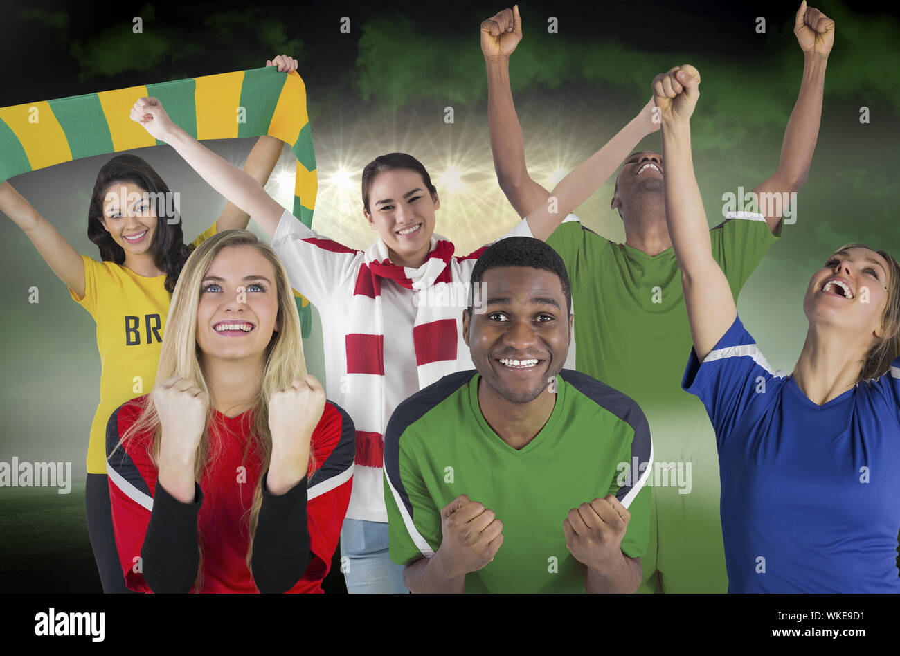 Composite image of various football fans against football pitch under ...