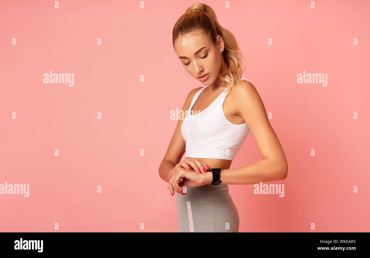 Girl Using Smartwatch Or Fitness Tracker During Workout, Studio Shot ...