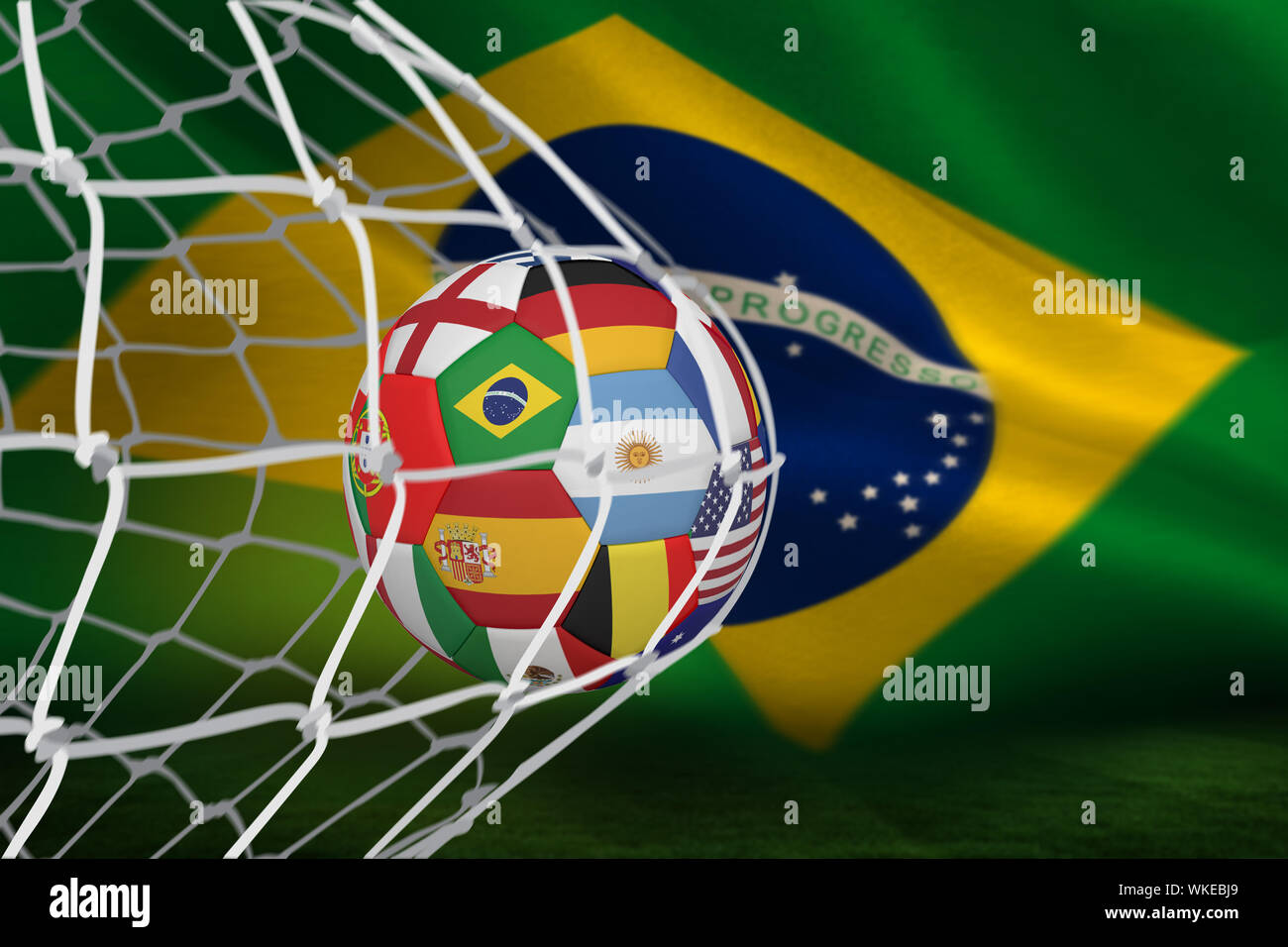 Football in multi national colours at back of net against brazilian ...