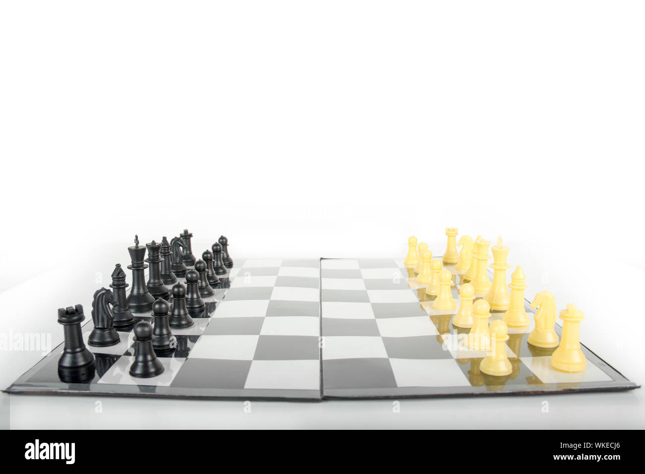 Chess pieces on a checkered board Stock Photo - Alamy