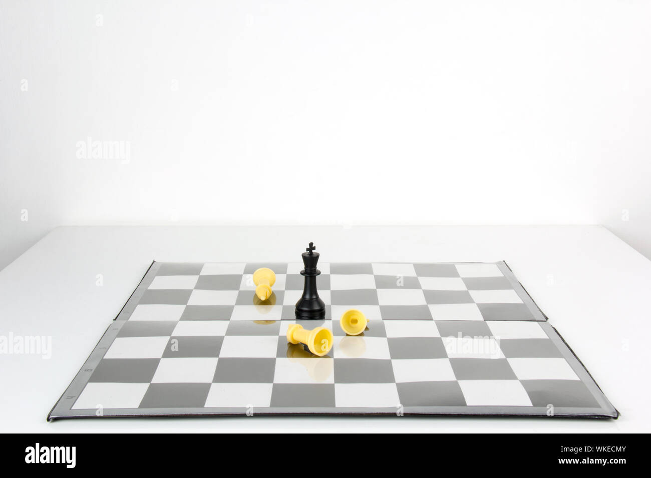 Black king winning the board game Stock Photo - Alamy