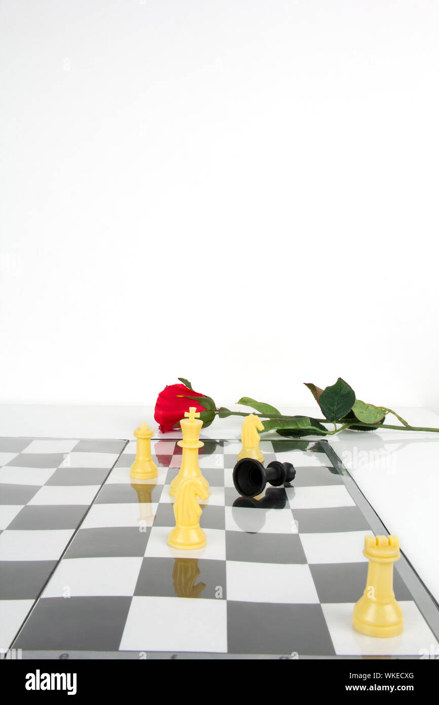 Black queen defeated by white king Stock Photo - Alamy