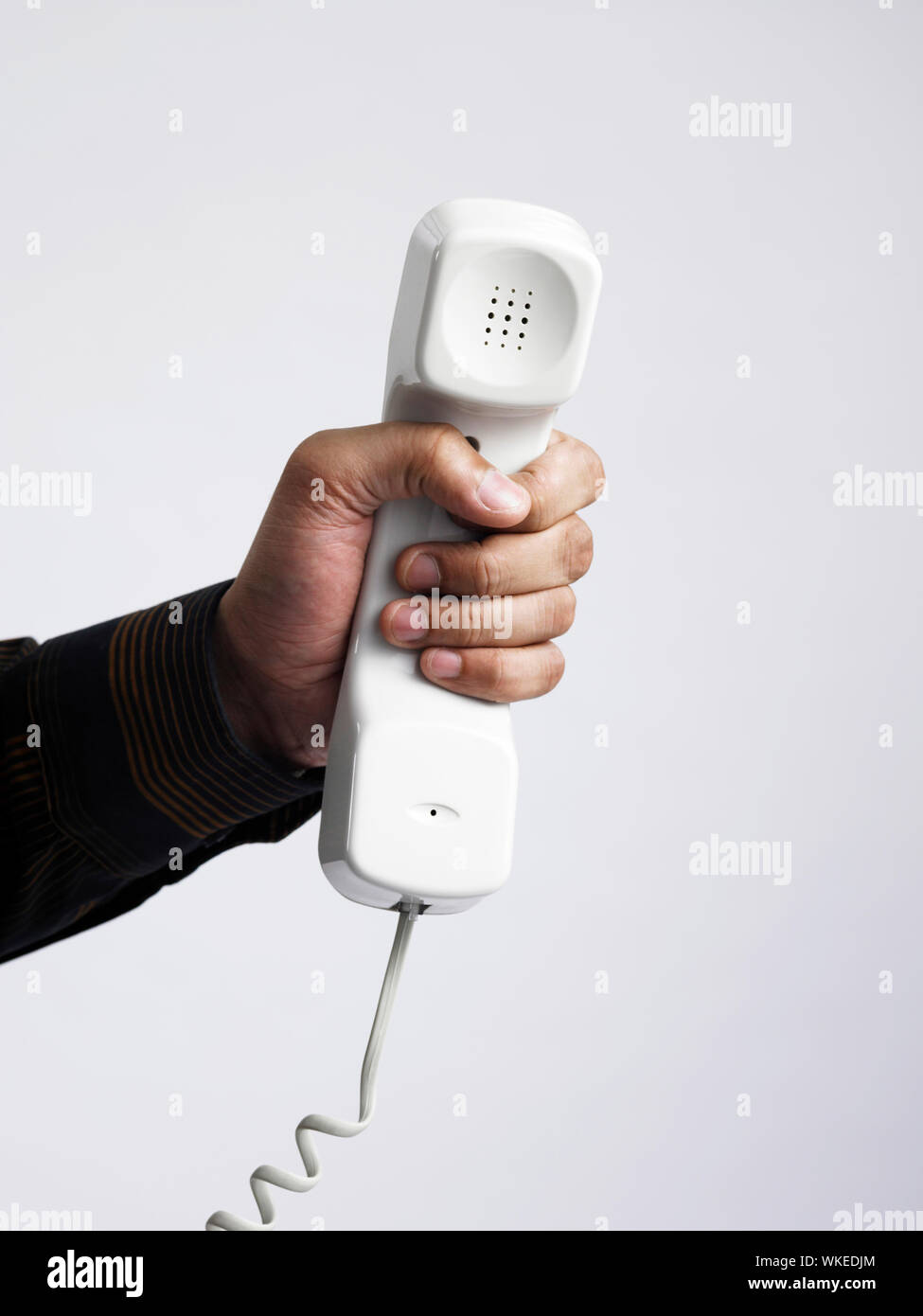 Human hand holding telephone cord hi-res stock photography and images ...