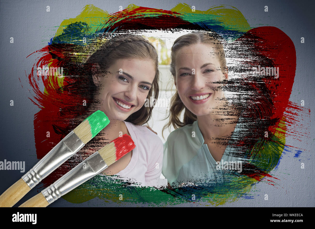 Composite image of friends smiling at camera with paintbrush dipped in ...