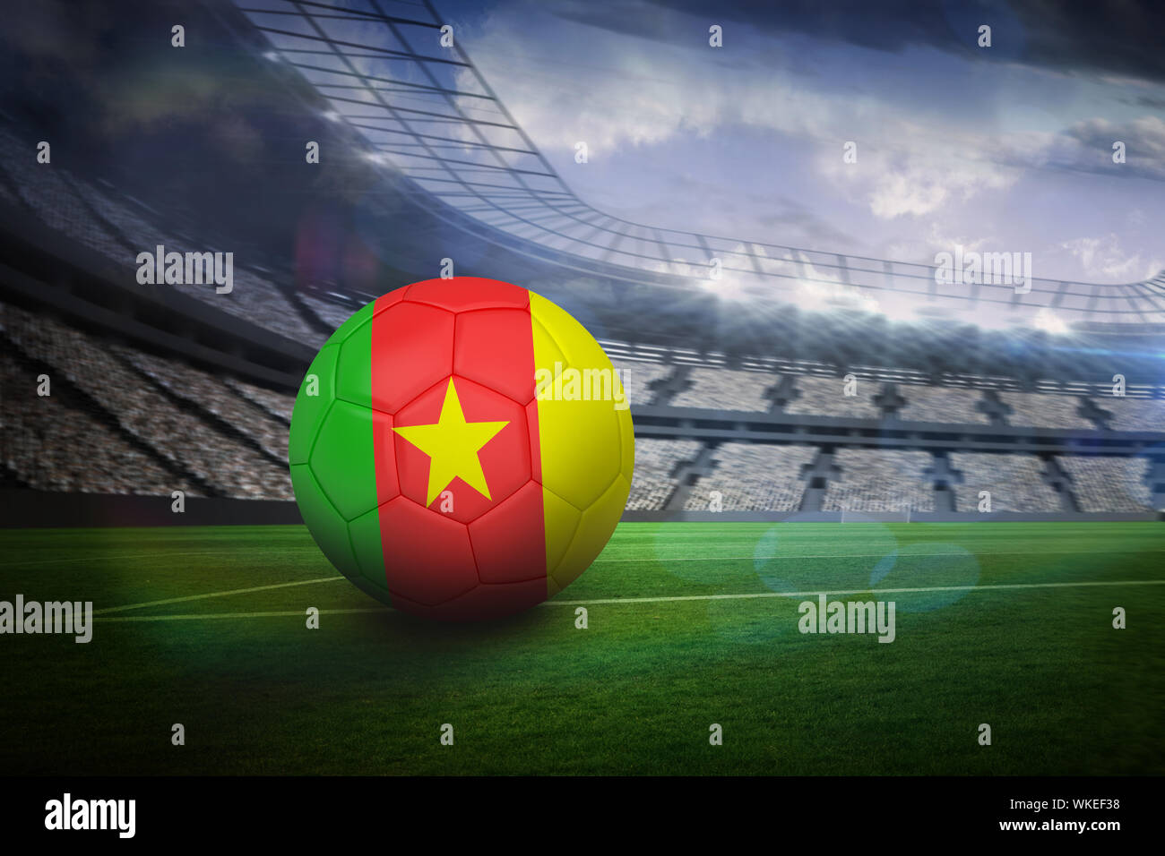 Football in cameroon colours in large football stadium with lights ...