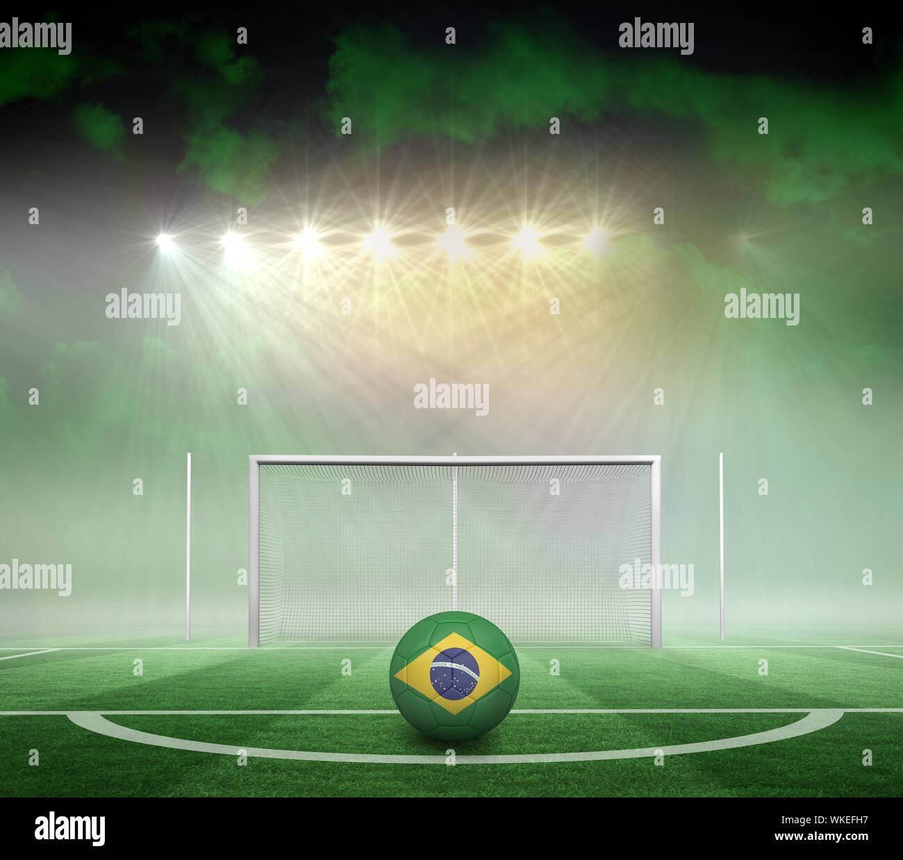 Football in brasil colours against football pitch under spotlights ...