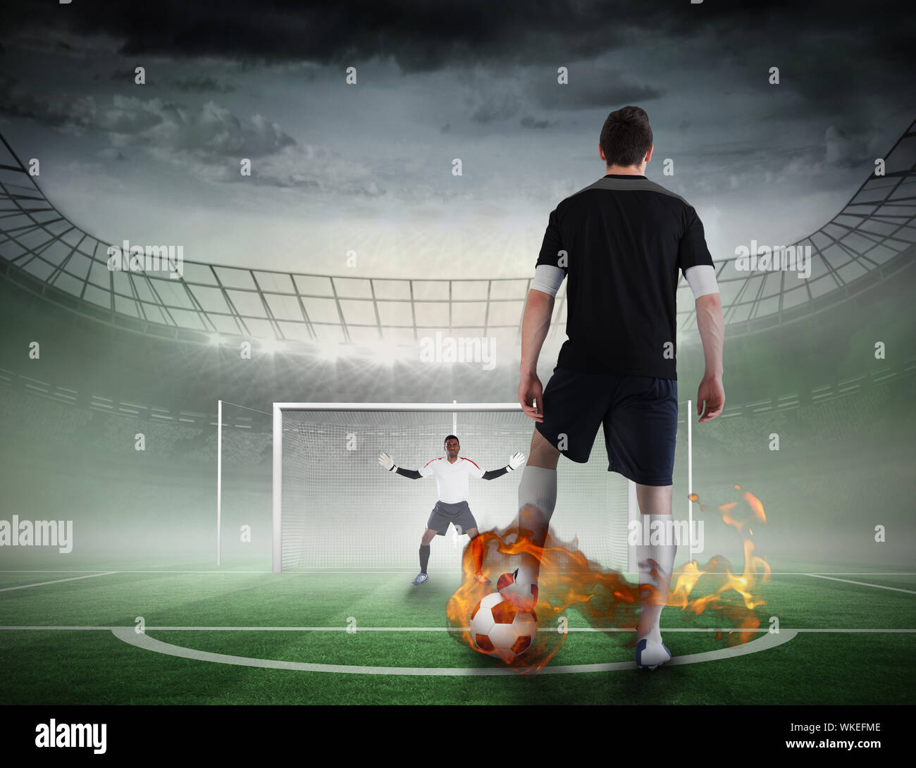 Composite image of football player about to take a penalty against ...
