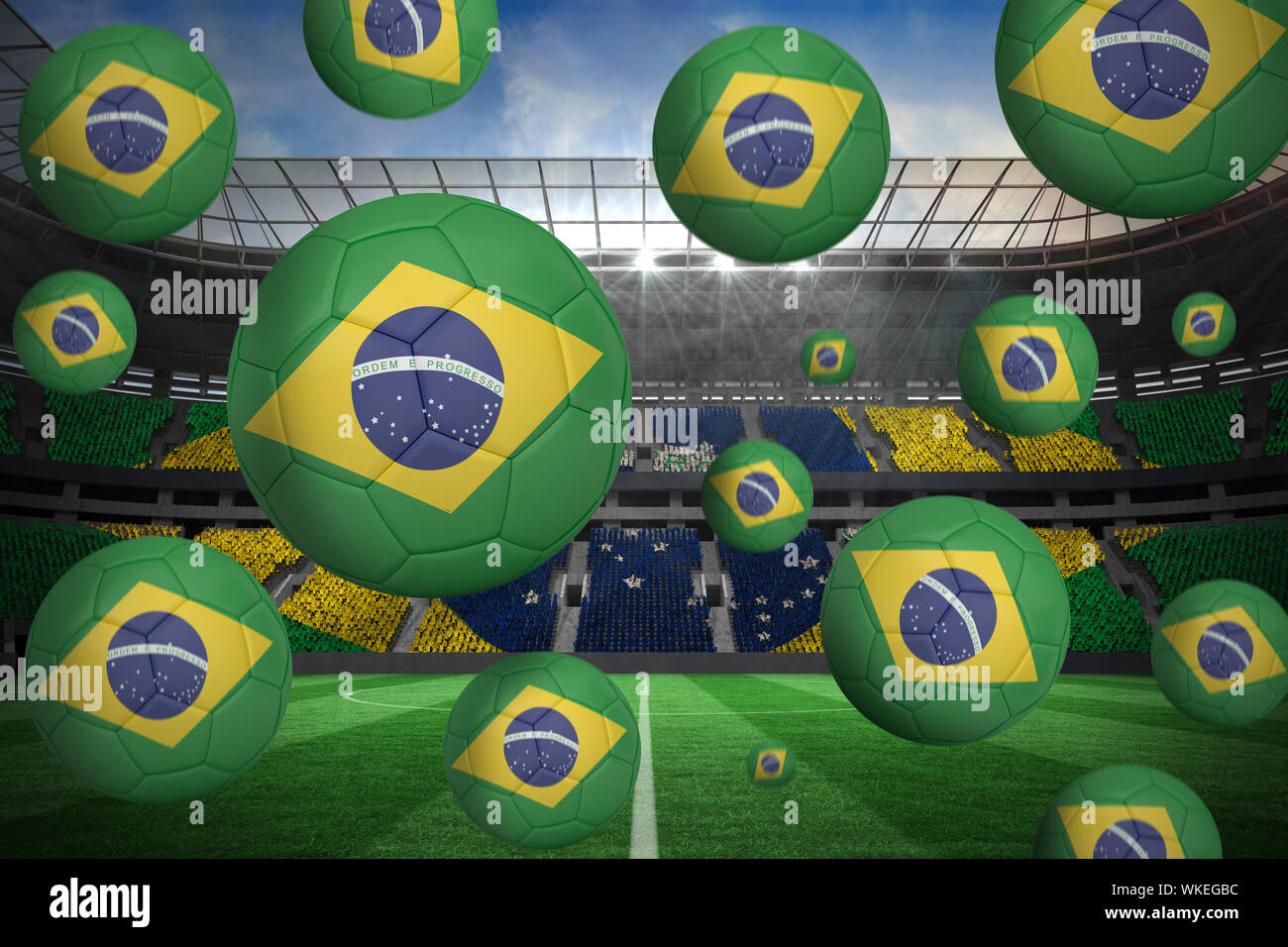 Footballs in brasil flag colours against large football stadium with ...