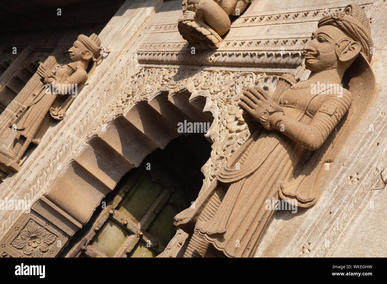 India, Madhya Pradesh, Maheshwar, Statues on either side of a doorway ...