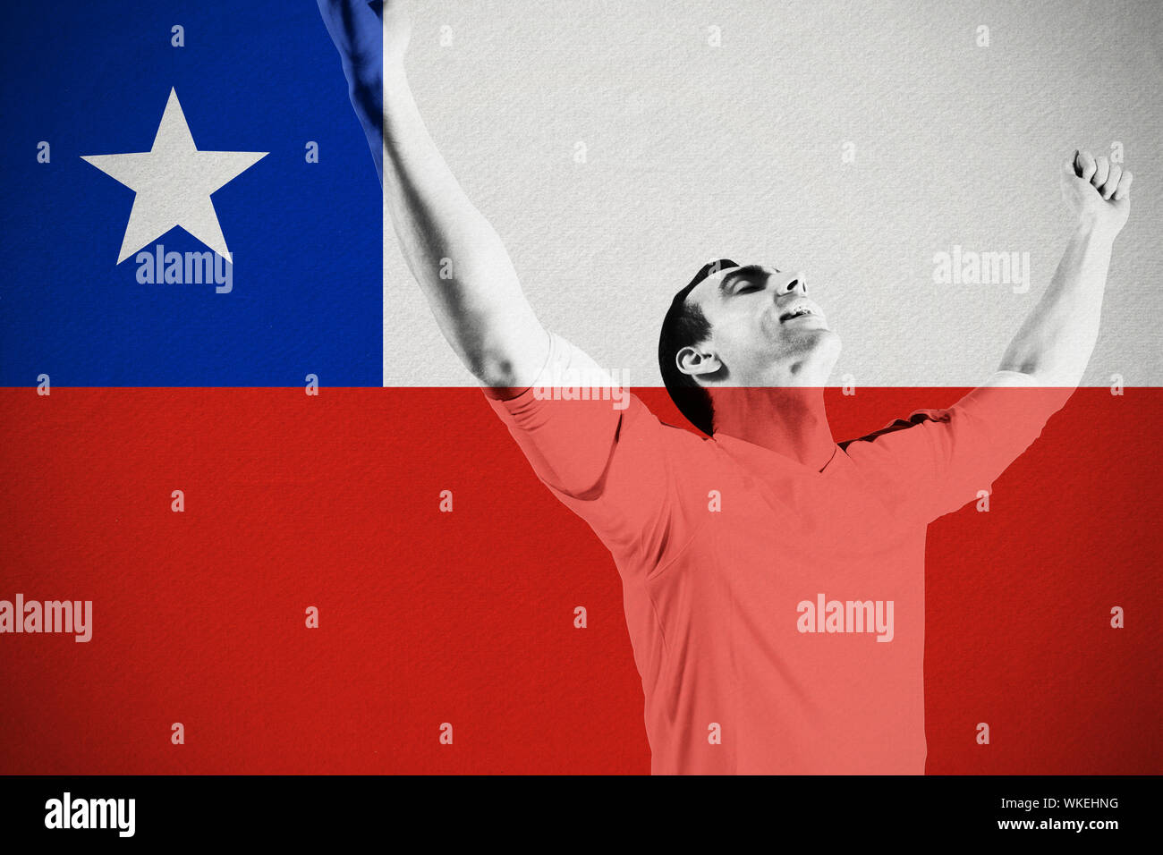 Excited football fan cheering against large football stadium with fans ...