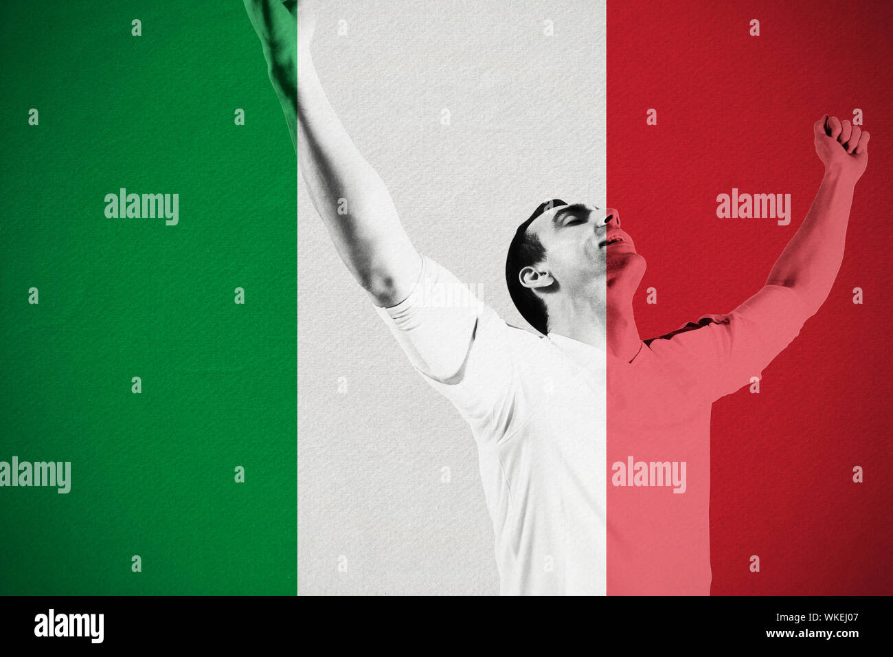 Excited football fan cheering against italy national flag Stock Photo ...