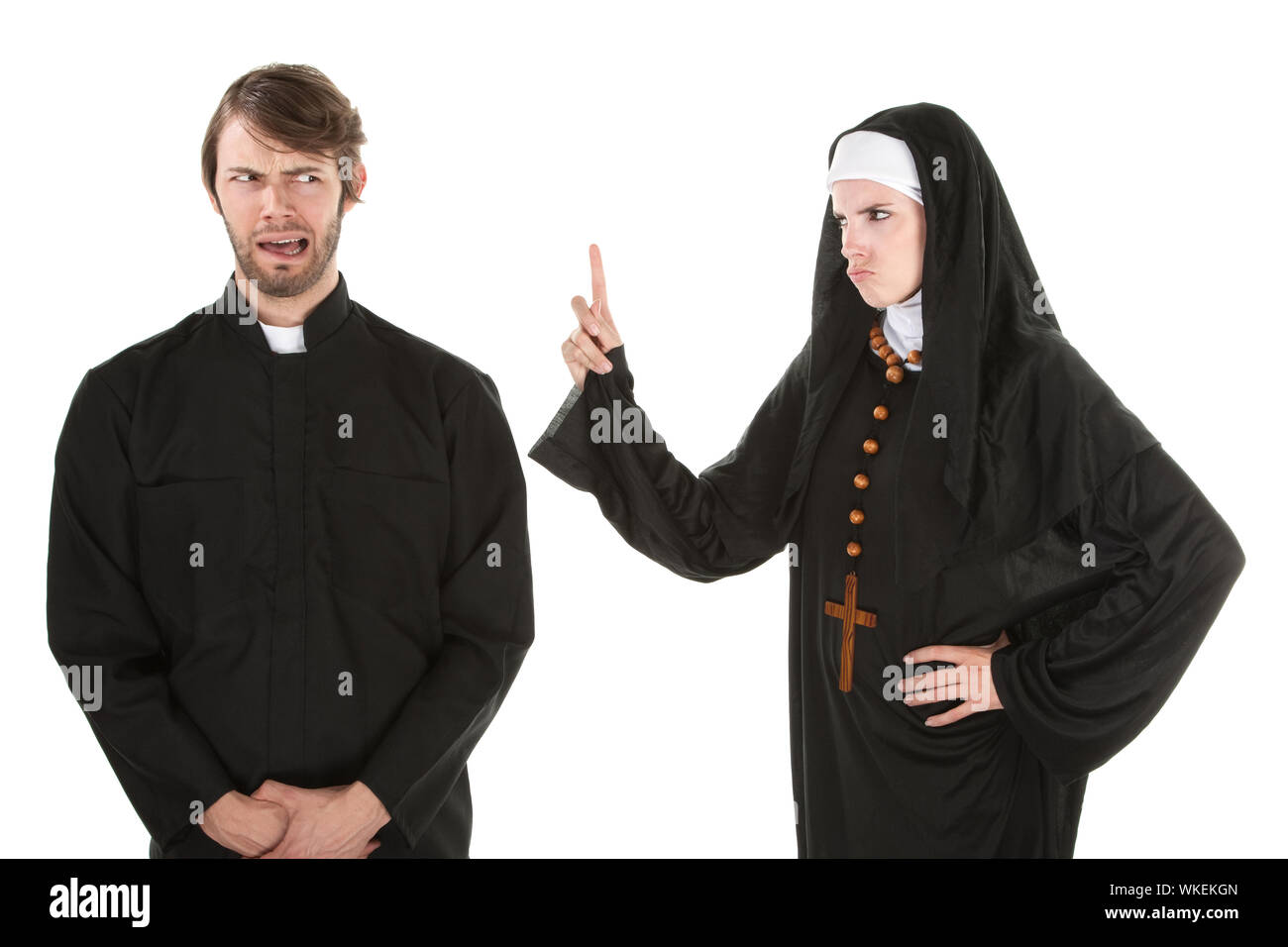 A young Catholic priest and nun bursting in laughter Stock Photo - Alamy