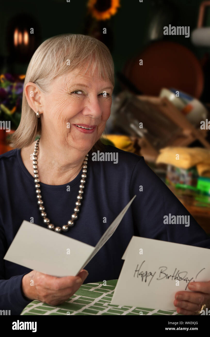 Elderly woman reading greeting hi-res stock photography and images - Alamy