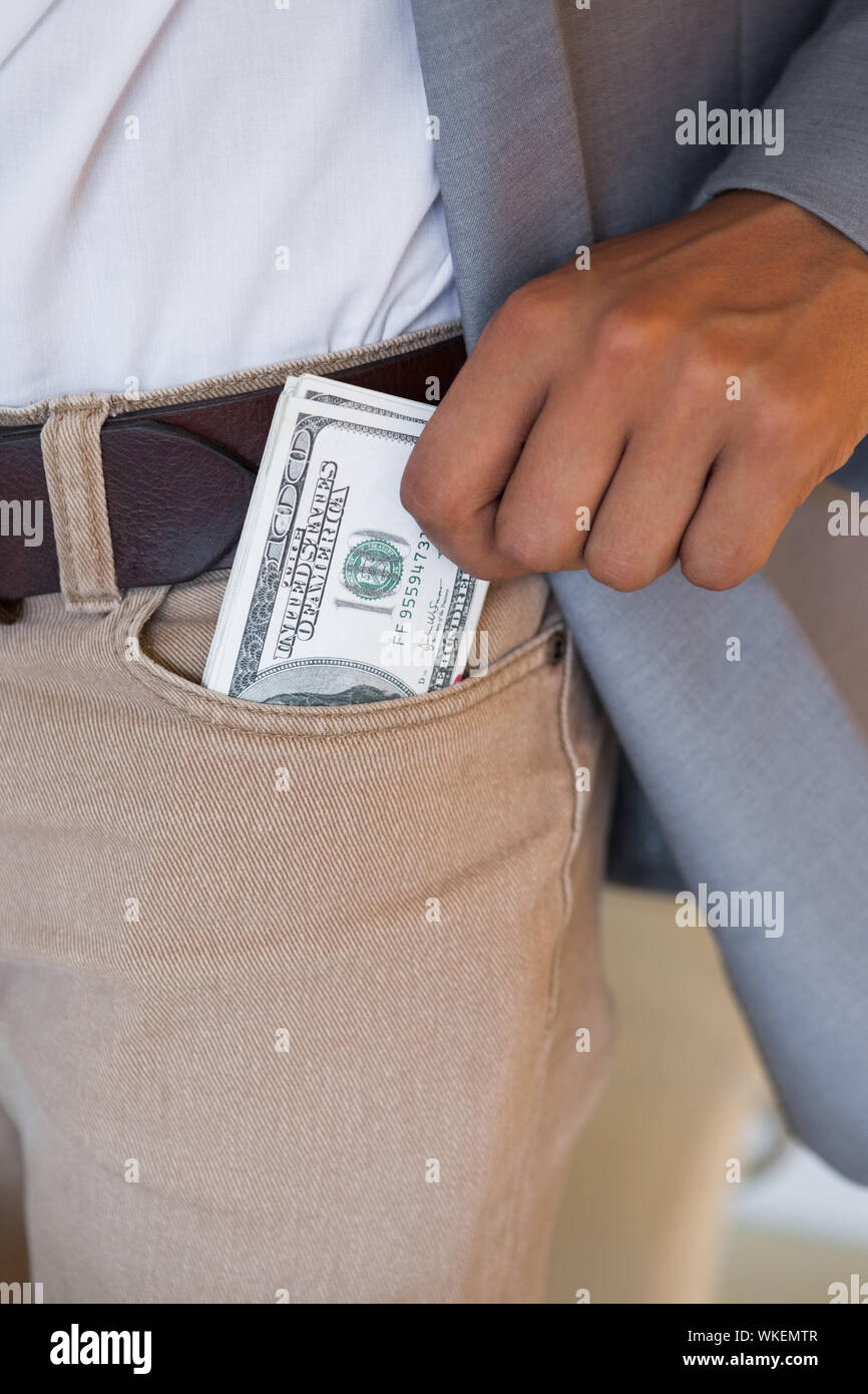 Pocketing cash hi-res stock photography and images - Alamy