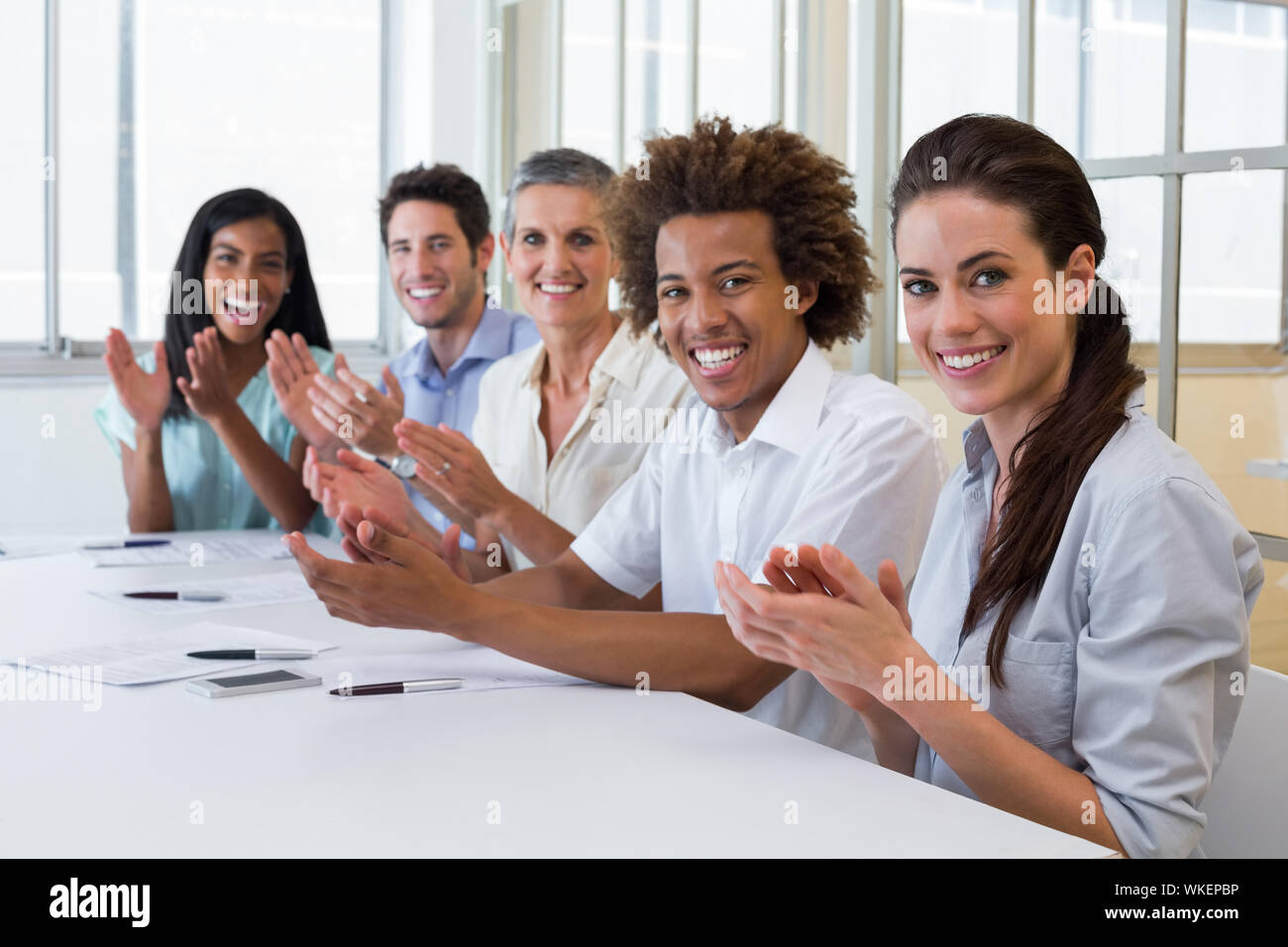Portrait smiling woman clapping applauding hi-res stock photography and ...