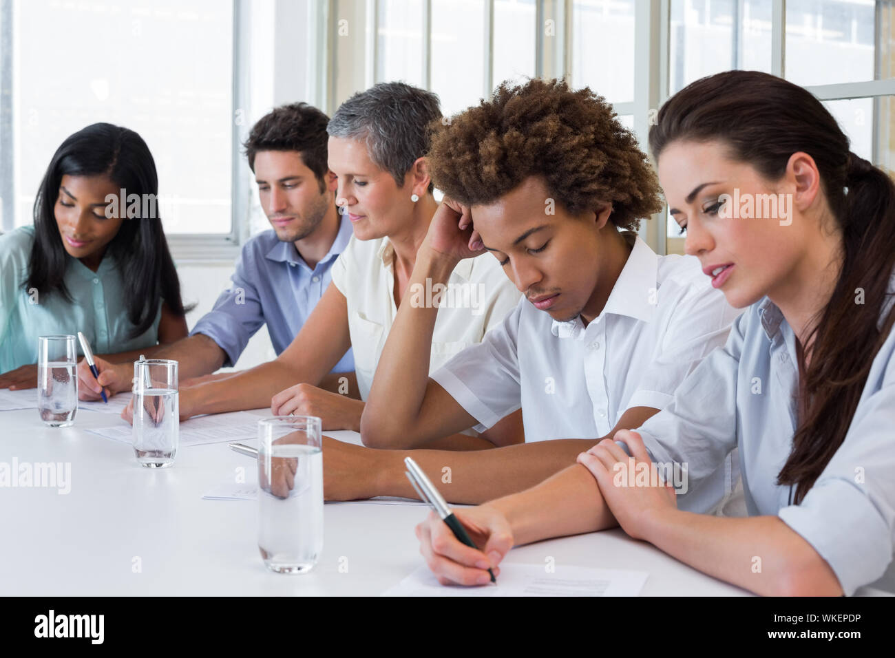 Business people taking down important notes in the office Stock Photo ...