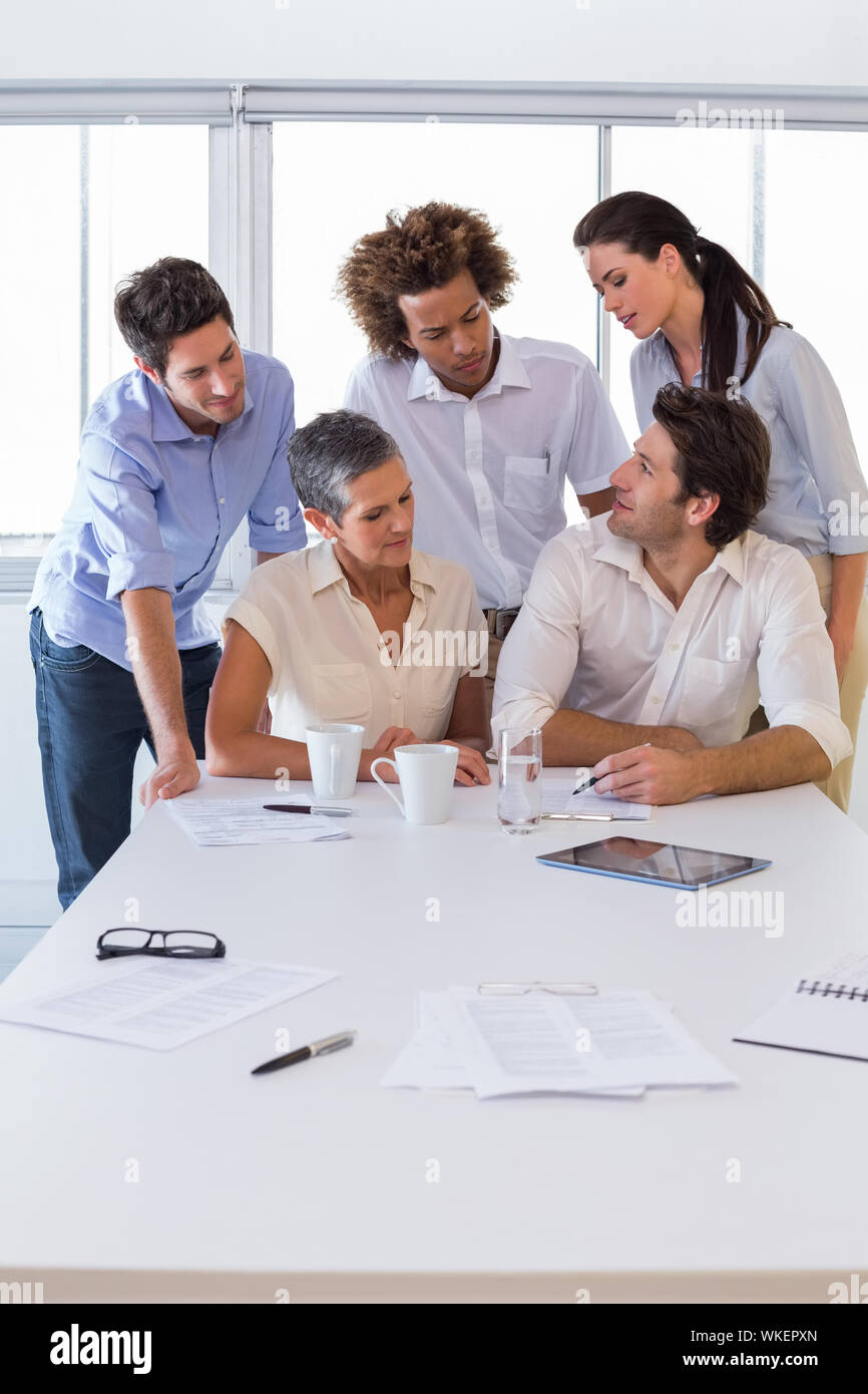 Attractive business people working together in the workplace Stock ...
