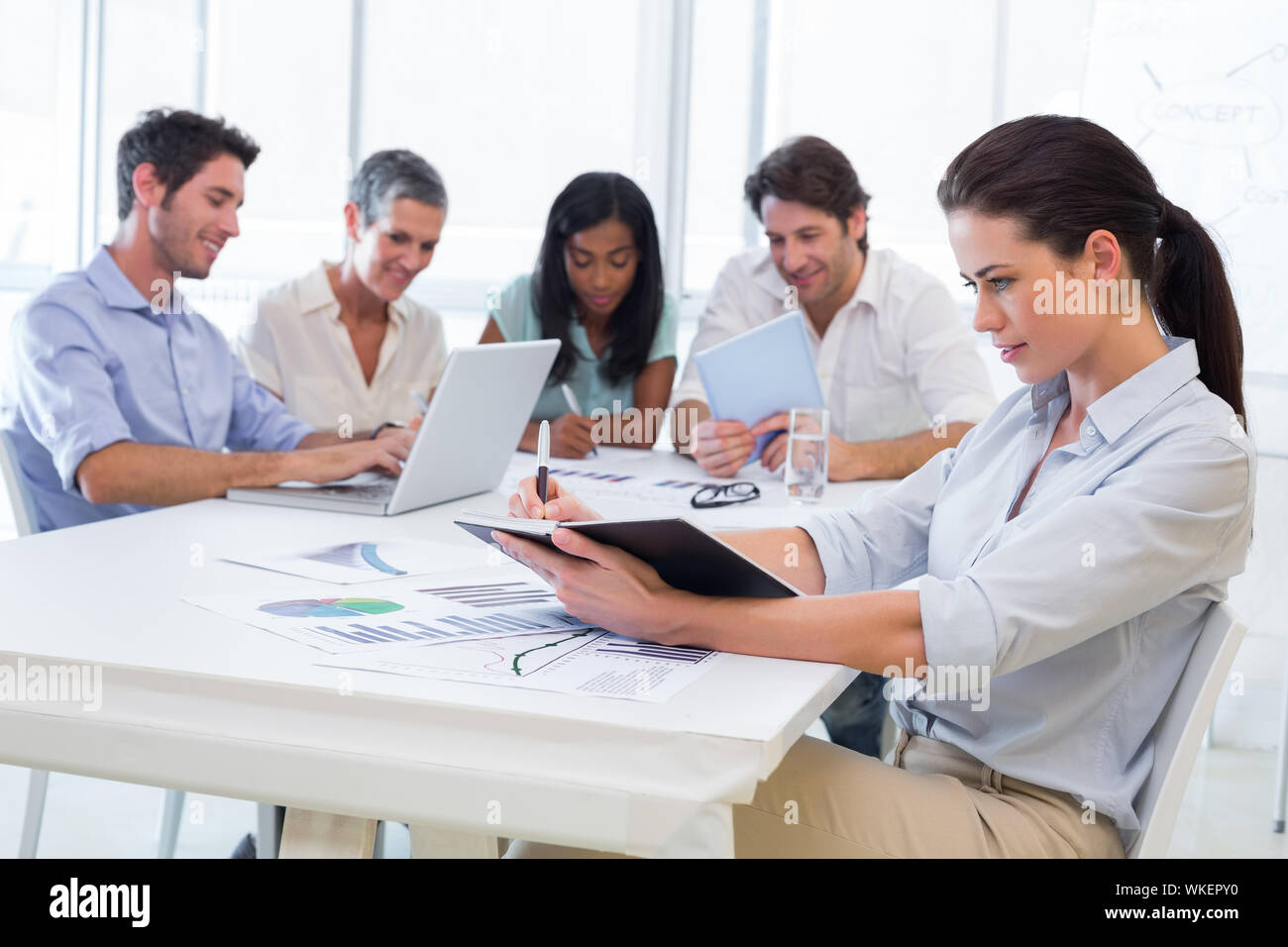 Attractive business people working together in the workplace Stock ...