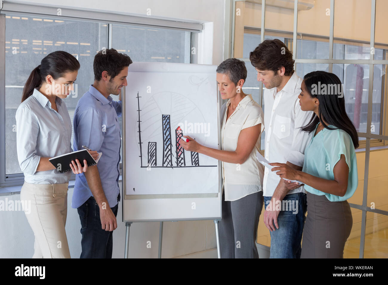 Business people working on graph for presentation in the office Stock ...