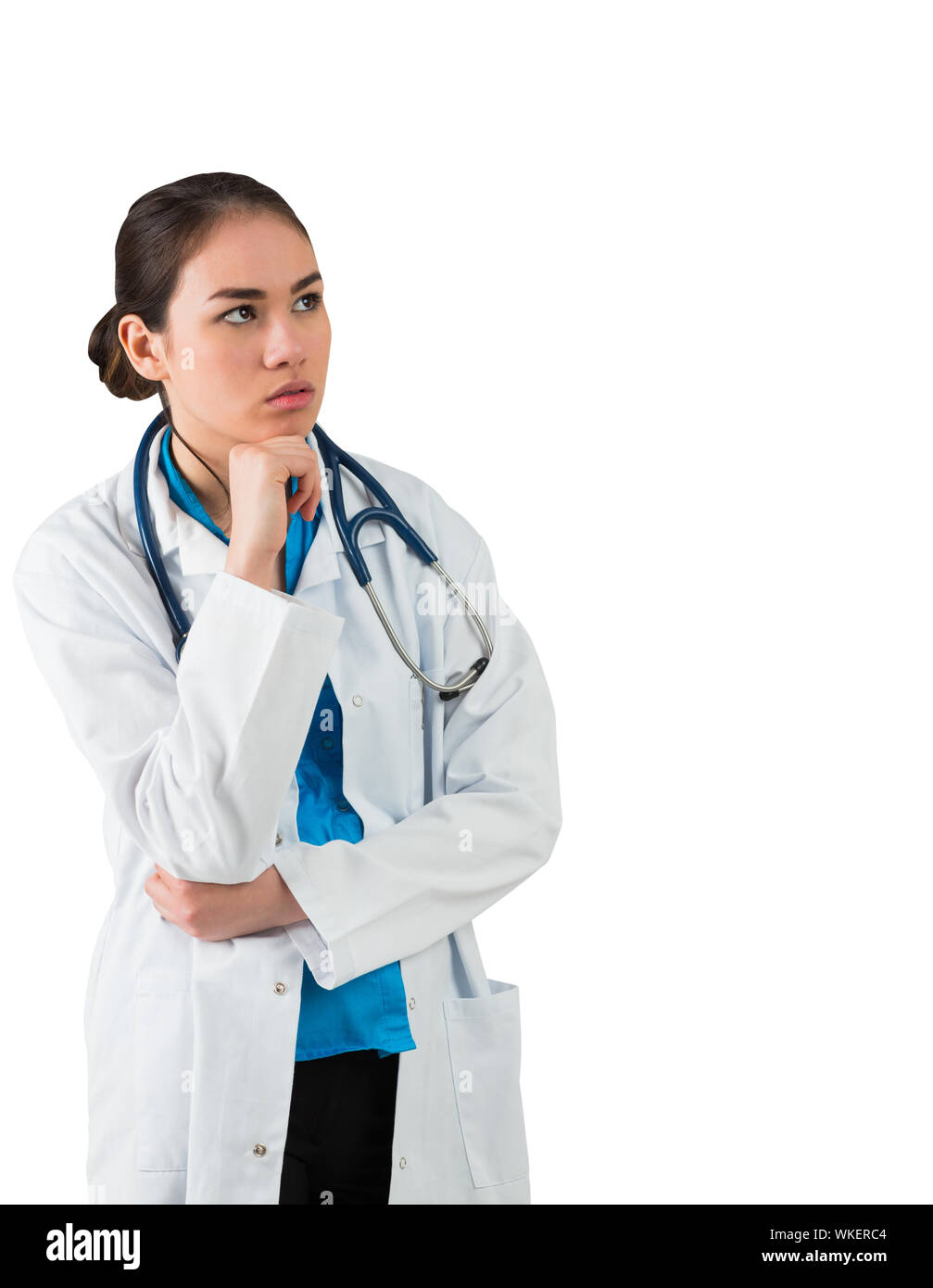 Serious doctor in lab coat thinking with hand on chin on white ...