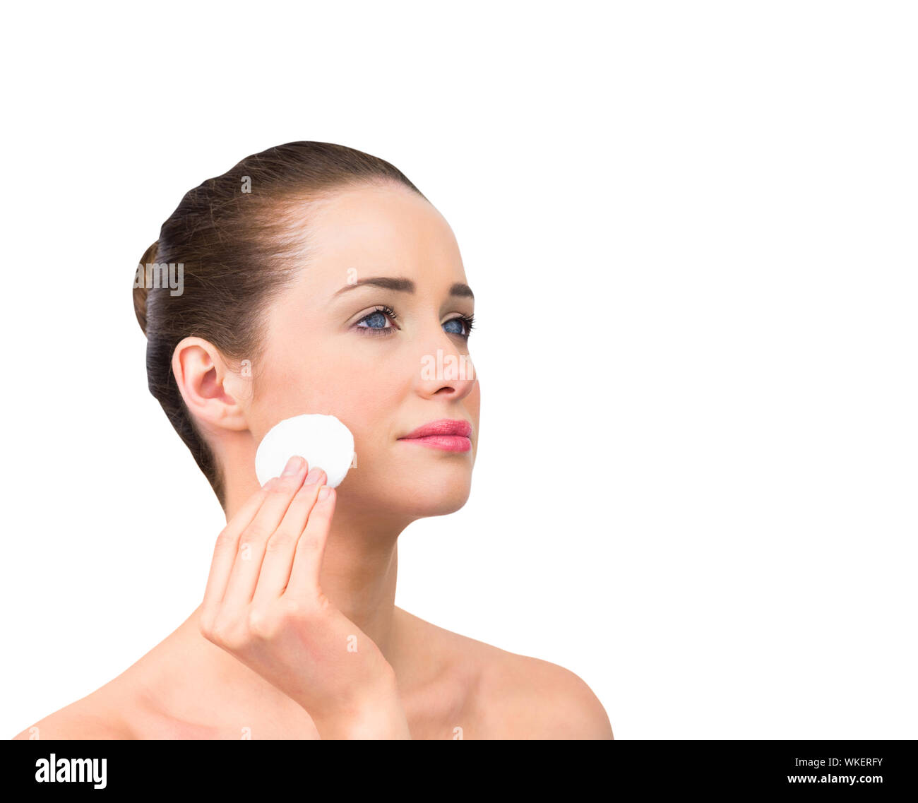 Natural beauty cleansing her face on white background Stock Photo - Alamy