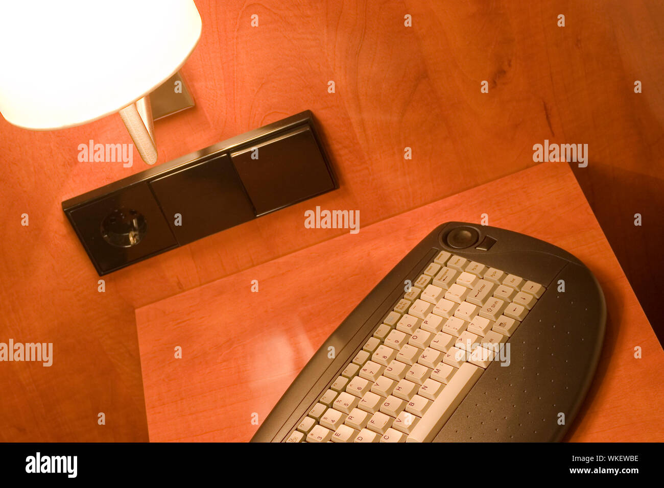 Keyboard on a table of exotic woods Stock Photo - Alamy