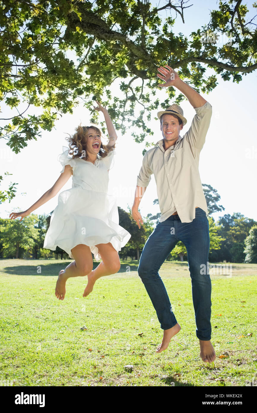 Woman leaping on grass hi-res stock photography and images - Alamy