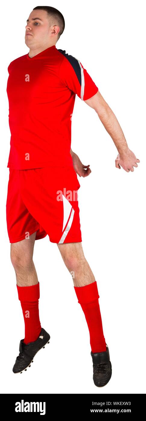 Fit football player jumping up on white background Stock Photo - Alamy