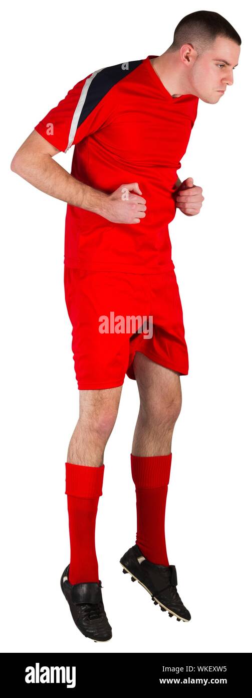 Fit football player jumping up on white background Stock Photo - Alamy