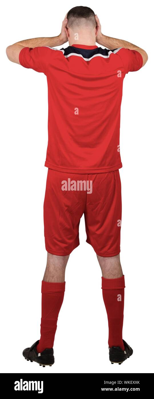 Disappointed football player looking down on white background Stock ...