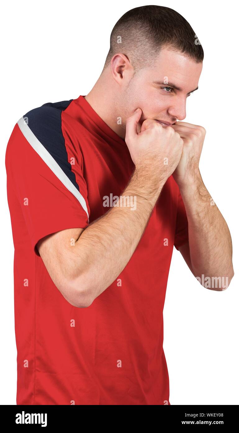 Nervous football player looking ahead on white background Stock Photo ...