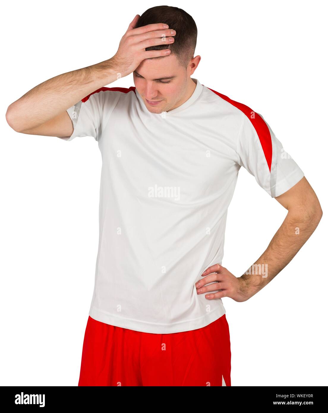 Disappointed football player looking down on white background Stock ...