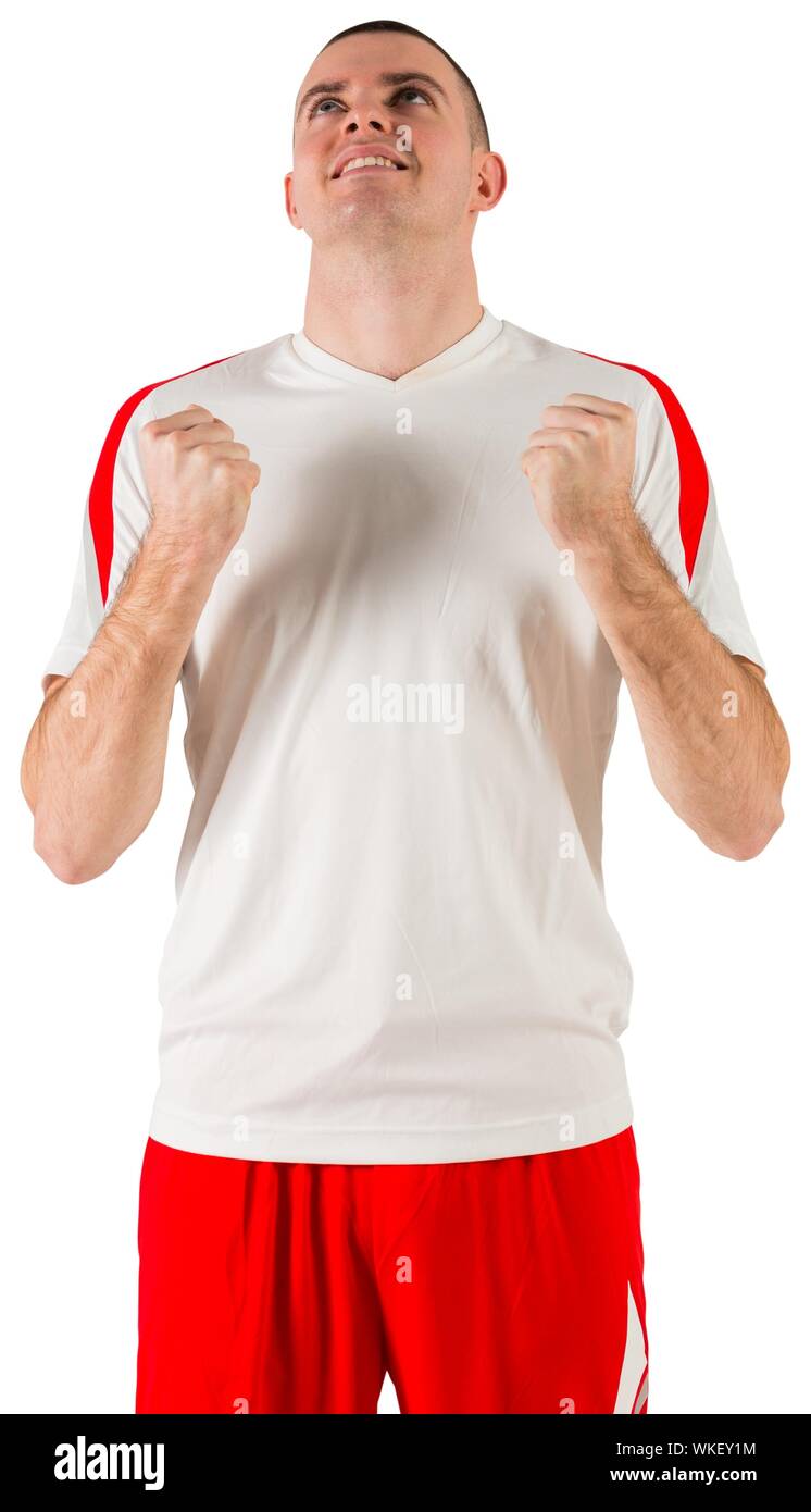 Excited football player cheering on white background Stock Photo - Alamy