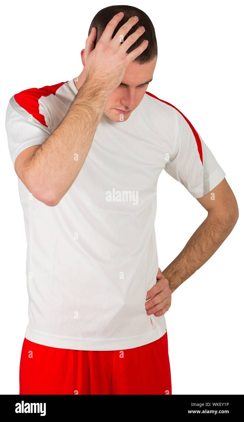 Disappointed football player looking down on white background Stock ...